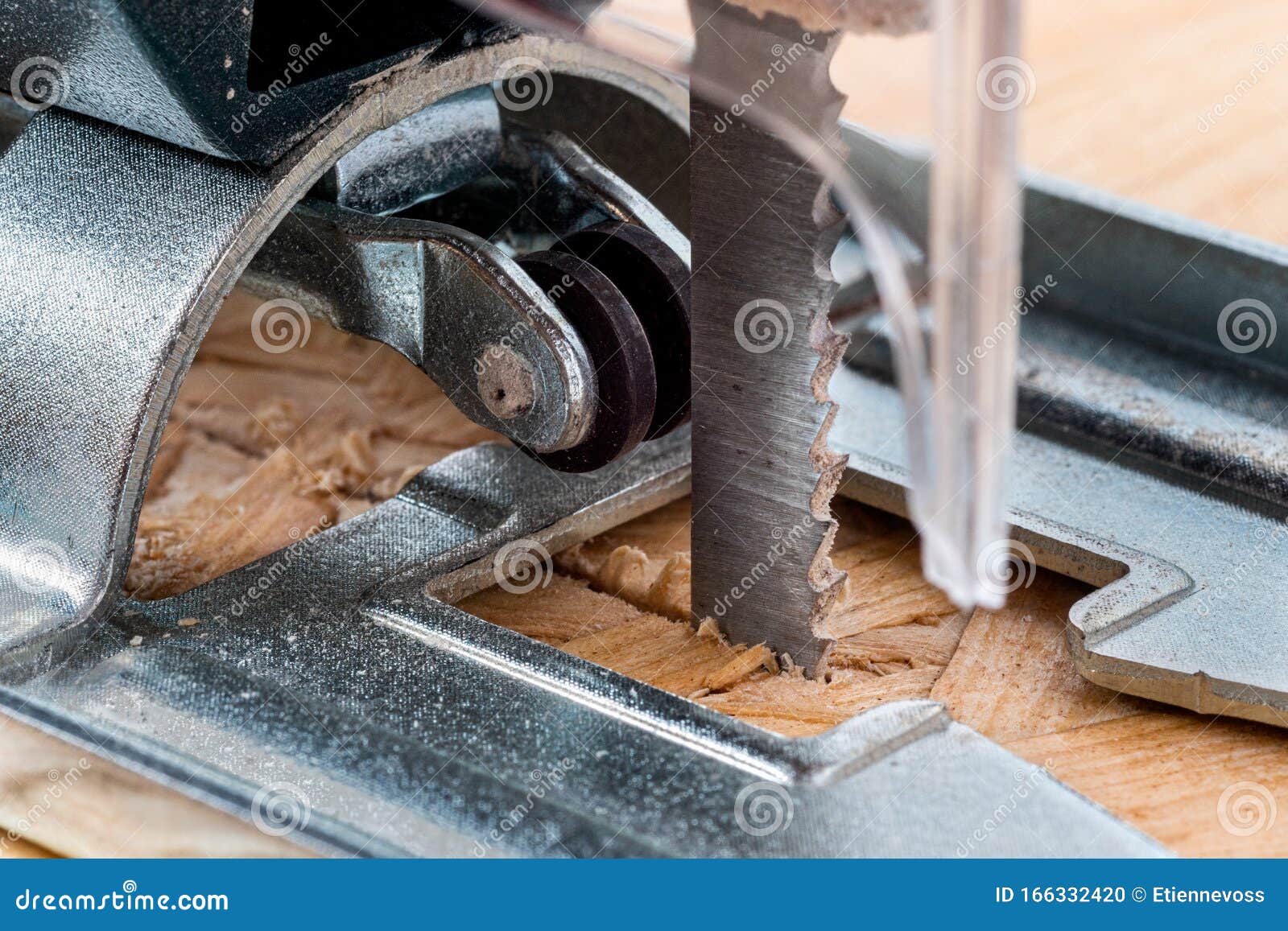 An Electrical Jigsaw Cutting through Chip Board. Blurred Background ...