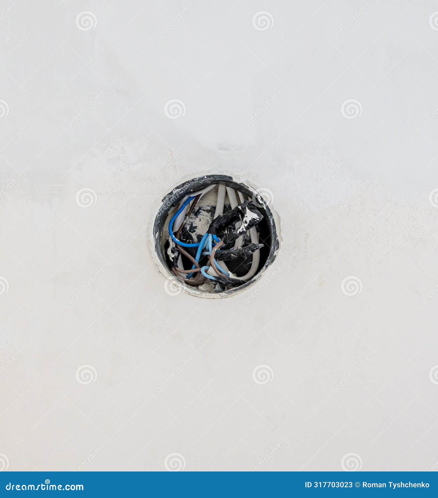 An Electrical Junction Box on a White Wall. the Electrical Wires Start ...