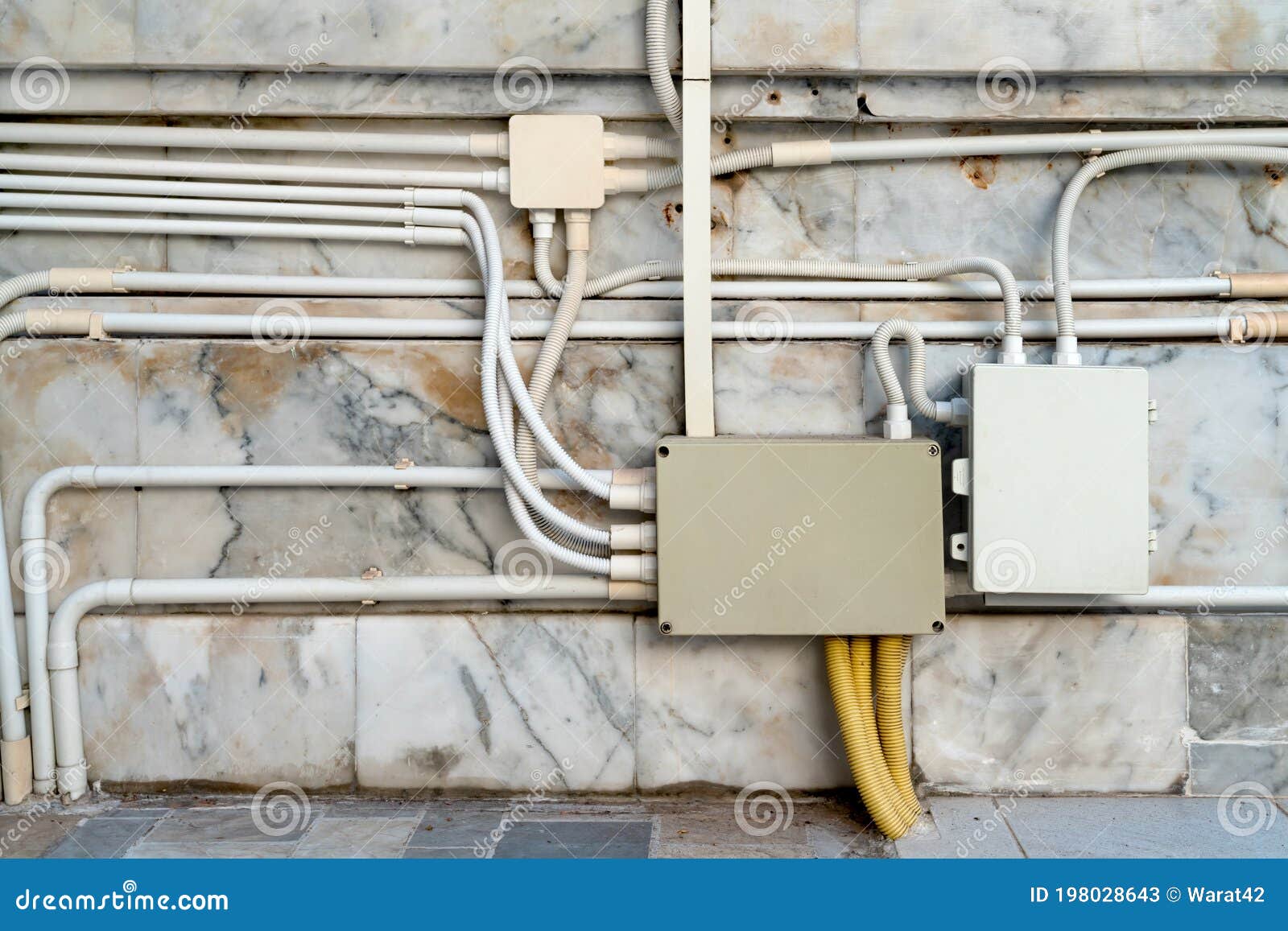 Electrical Junction Boxes with Plastic Pipe Connection on Marble Wall ...