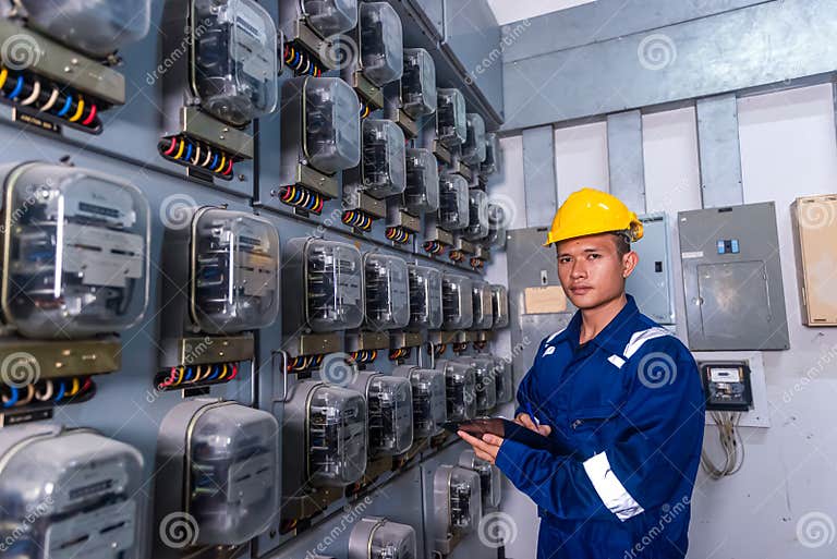 Electrical Maintenance Engineer is Checking .Electricity Meter, Main ...