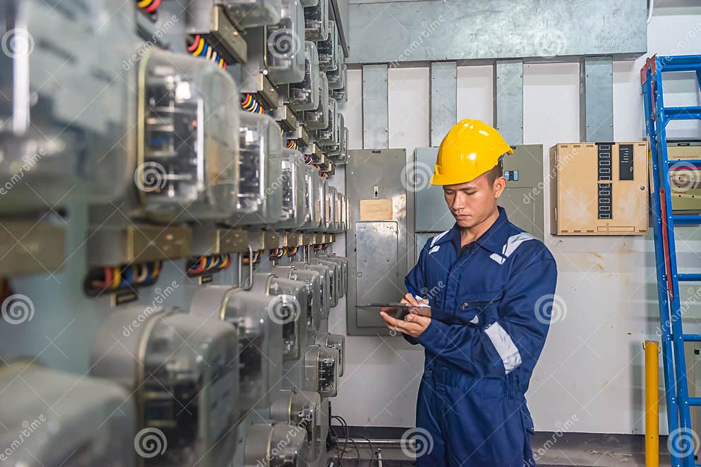Electrical Maintenance Engineer is Checking .Electricity Meter, Main ...