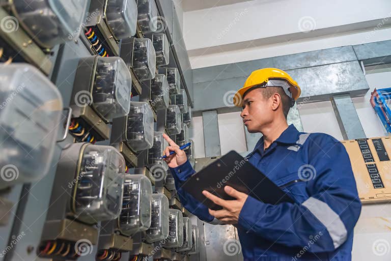 Electrical Maintenance Engineer is Checking .Electricity Meter, Main ...