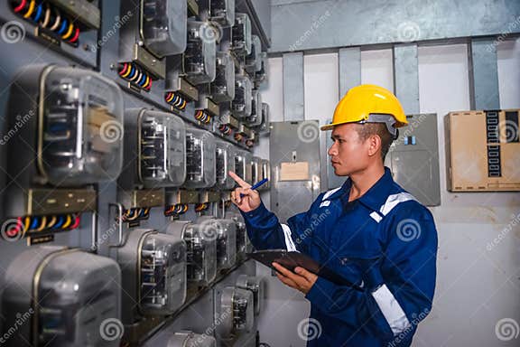 Electrical Maintenance Engineer is Checking .Electricity Meter, Main ...
