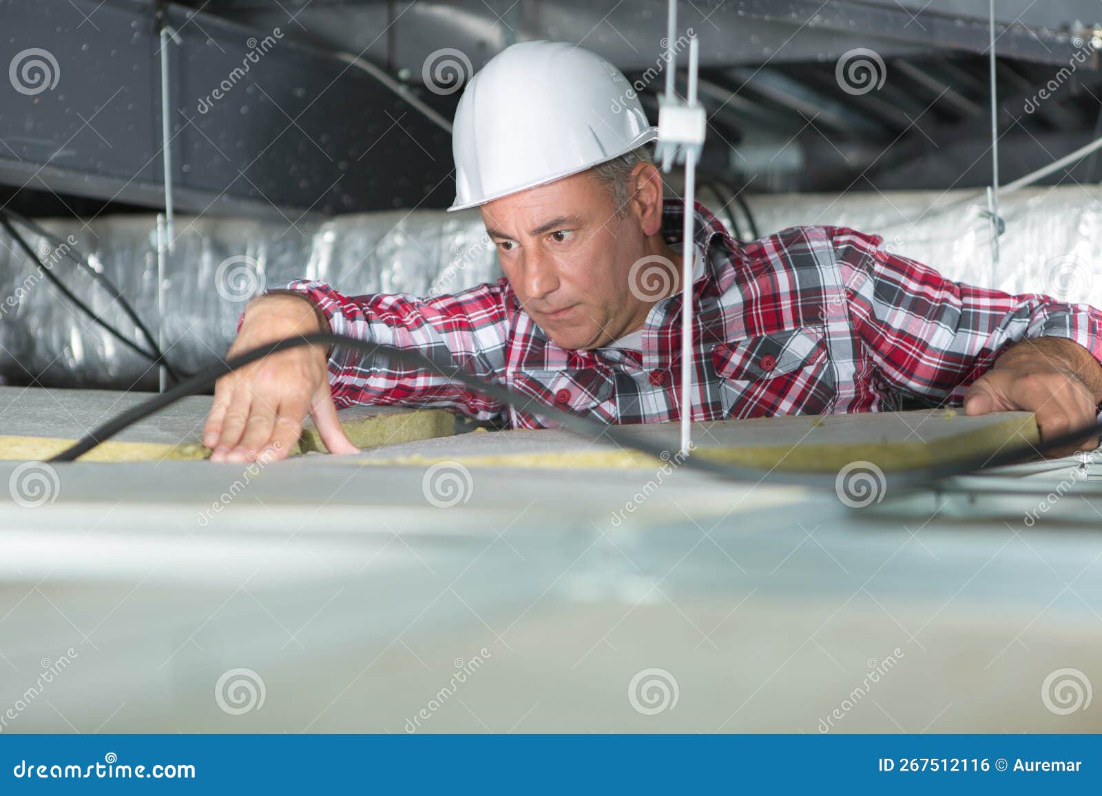 Electrical Maintenance Worker Checking Cables on Ceiling Stock Photo ...