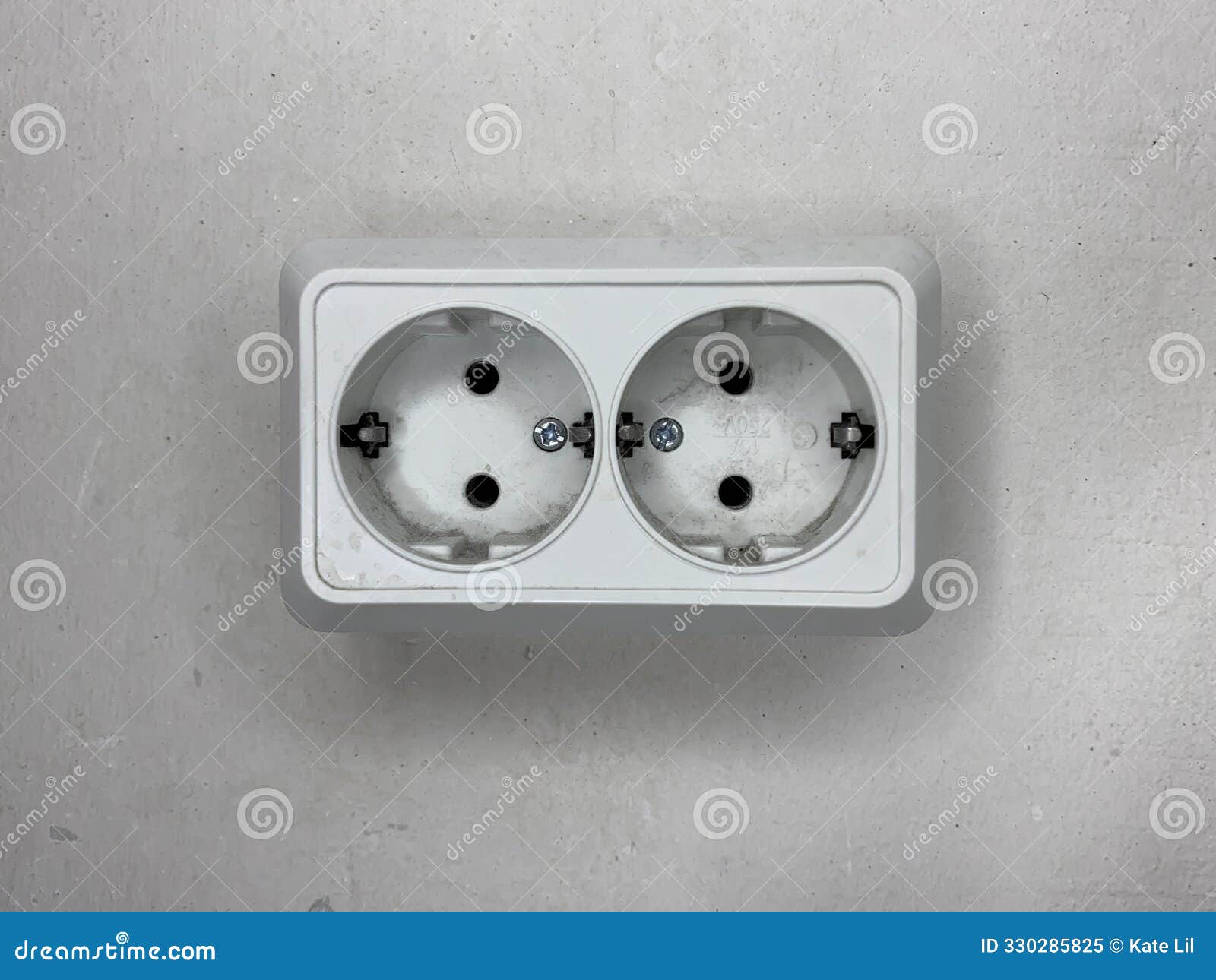Electrical Outlet with Cord on Plain Grey Background for Minimalistic ...