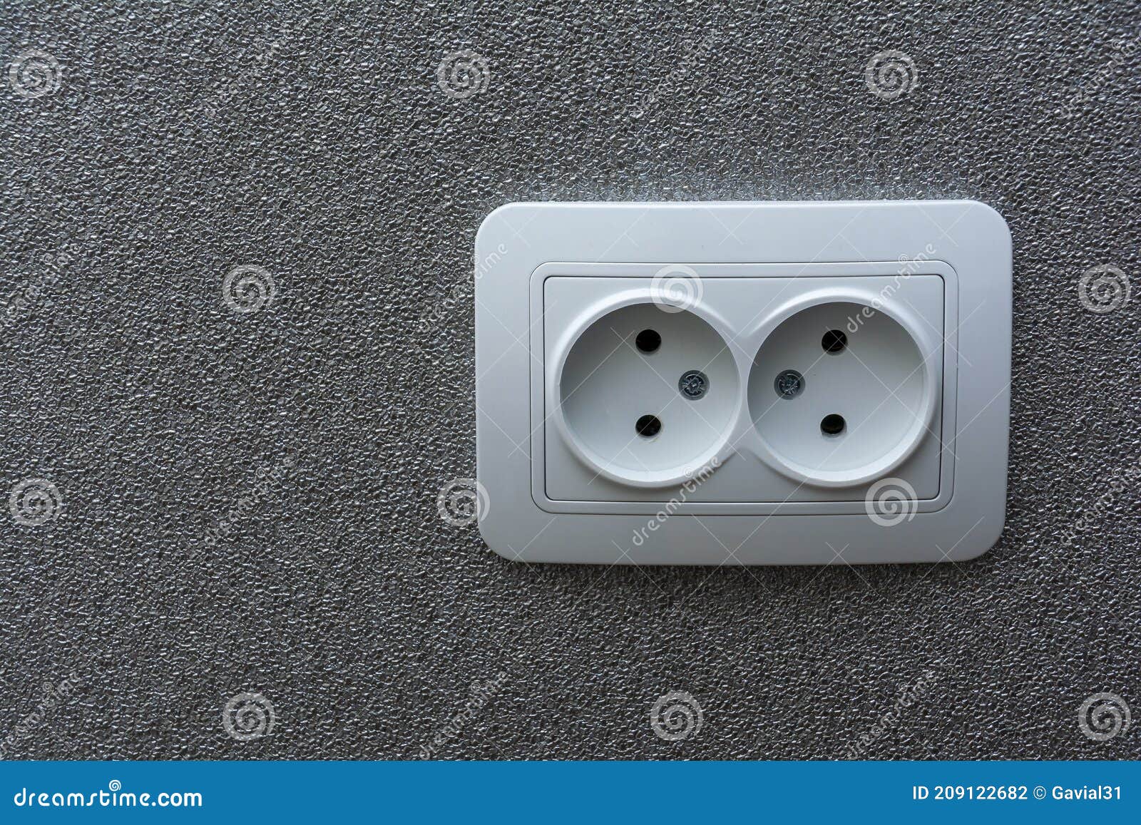 An Electrical Outlet on a Gray, Textured Wall. Image for Project and ...