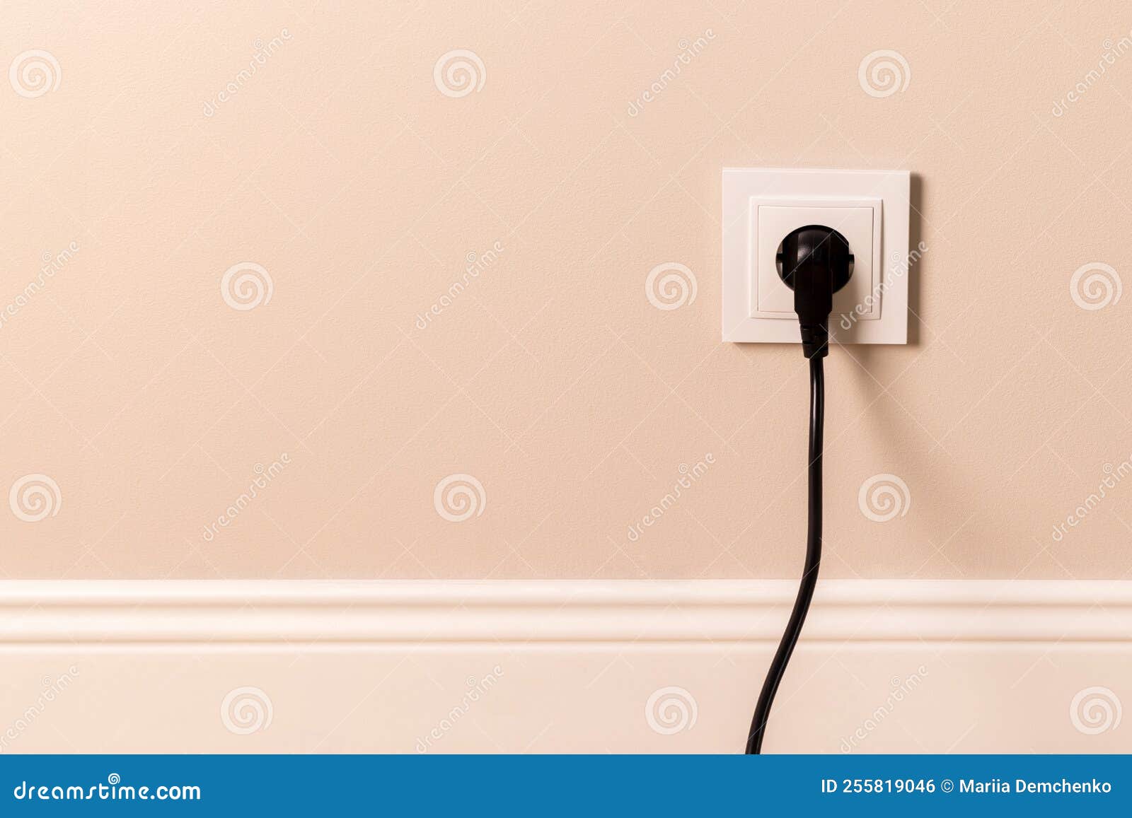 Electrical Outlet with Plug on Beige Wall Stock Photo - Image of ...