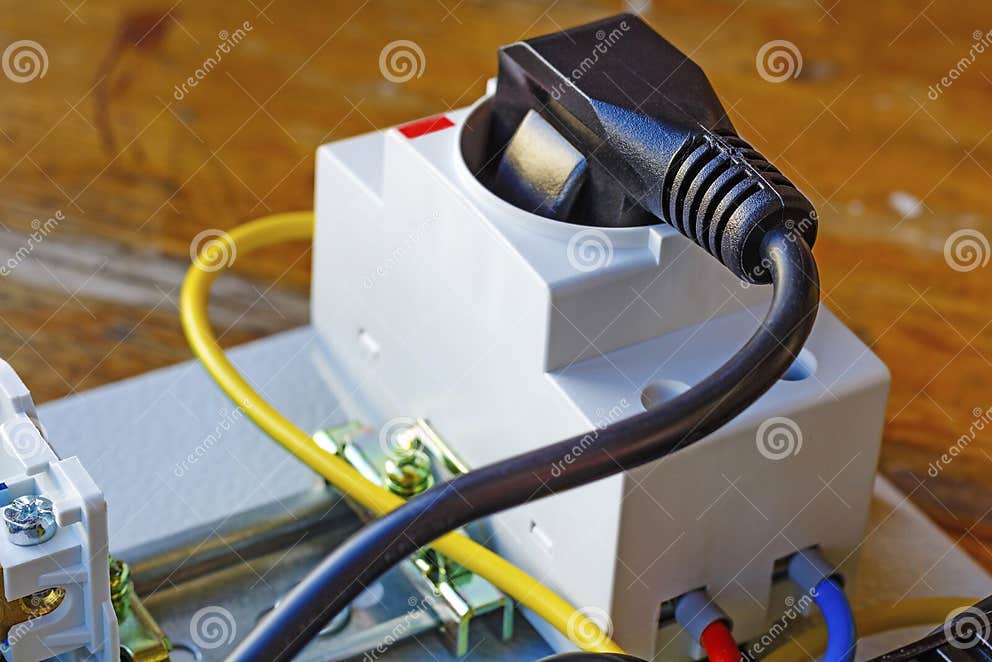 Electrical Outlet with Power Plug Installed on the DIN Rail Stock Image ...