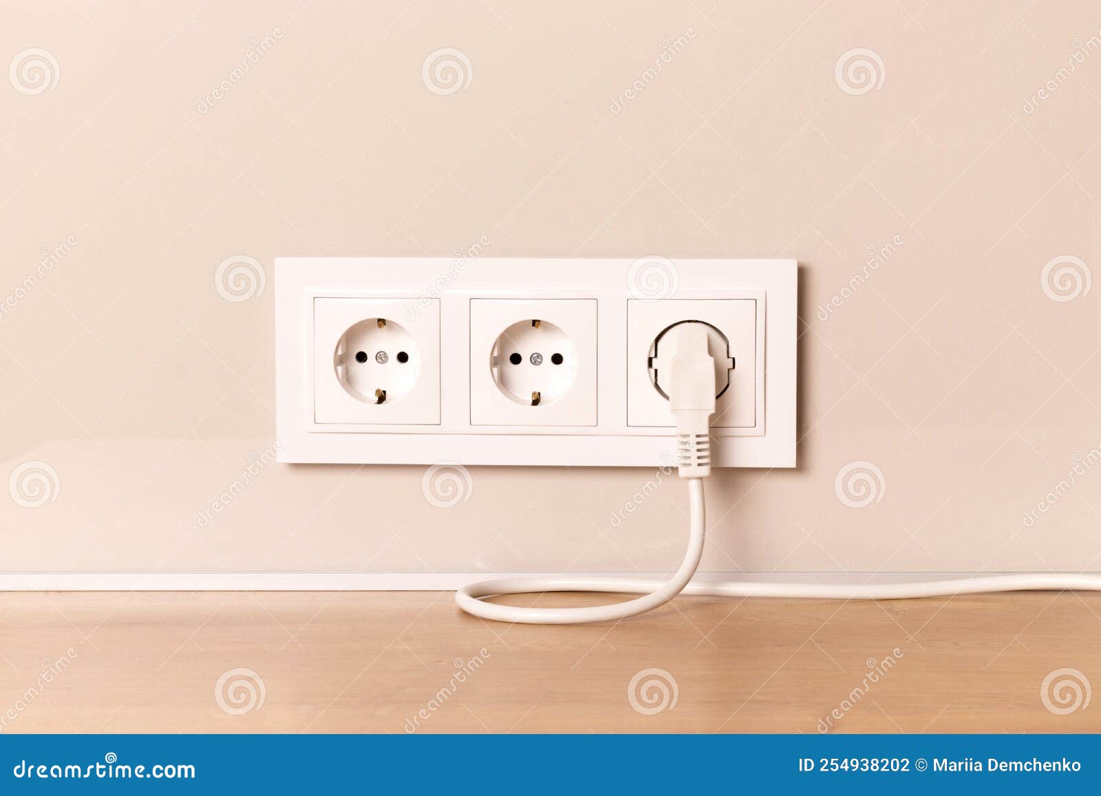 Electrical Outlets with Plug on Beige Wall Stock Photo - Image of ...