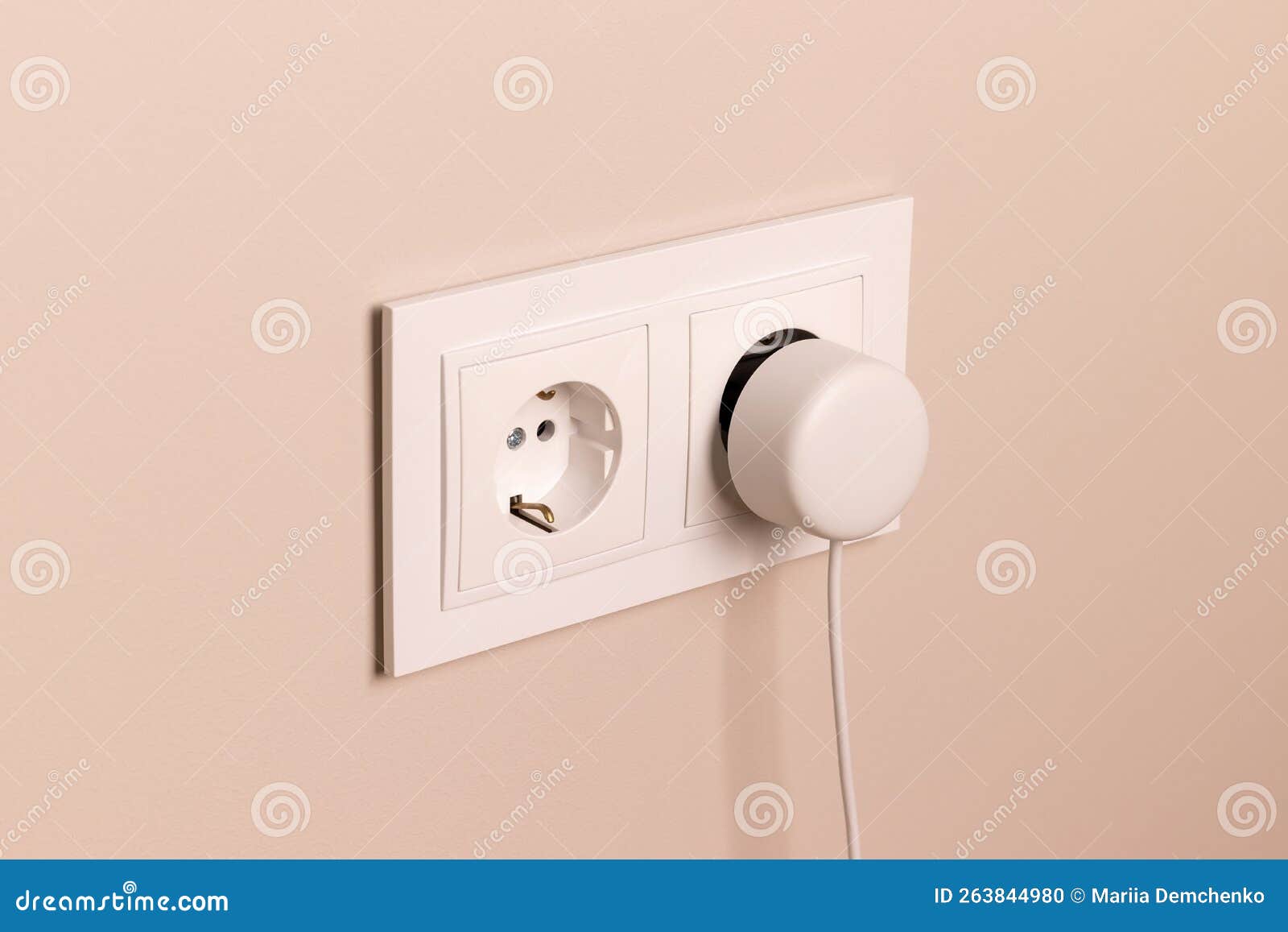 Electrical Outlets with Plug on Beige Wall Stock Photo - Image of ...