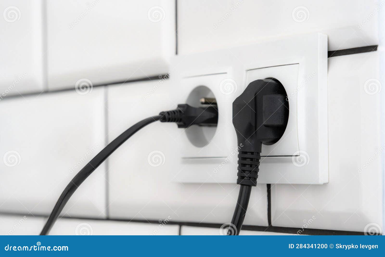Electrical plug in socket stock photo. Image of energy - 284341200