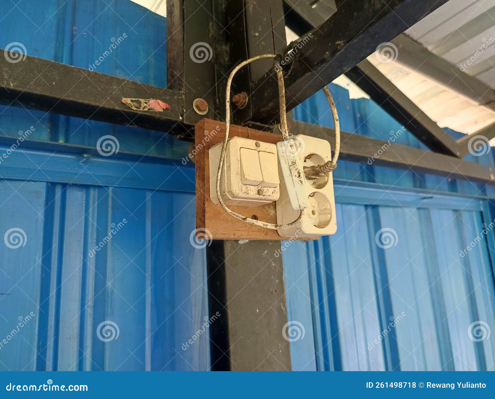 Electrical Plugs and Cables in an Open Space Behind the House Stock ...