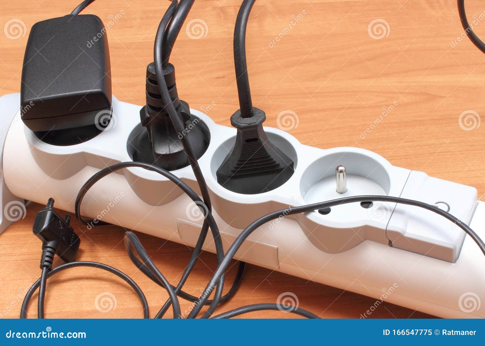 Electrical Plugs with Cords Connected To Power Strip. Concept of Energy ...