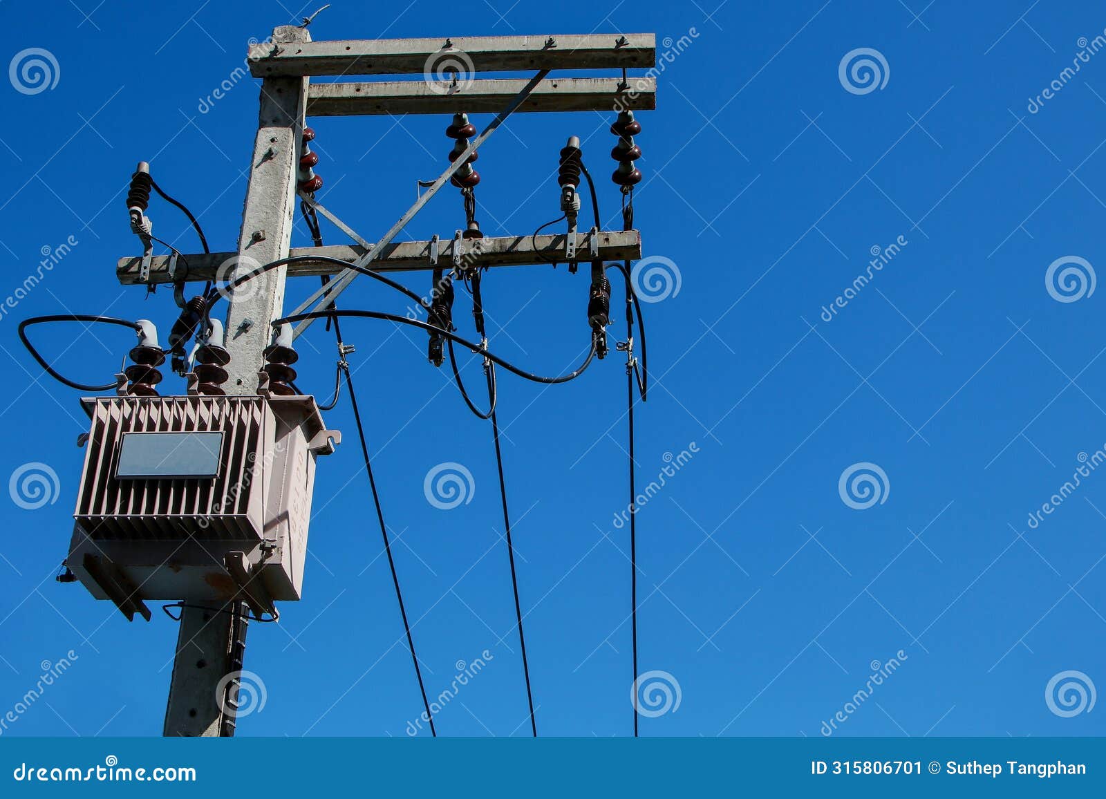 Electrical Poles Equipped with Large Power Transformers the Background ...
