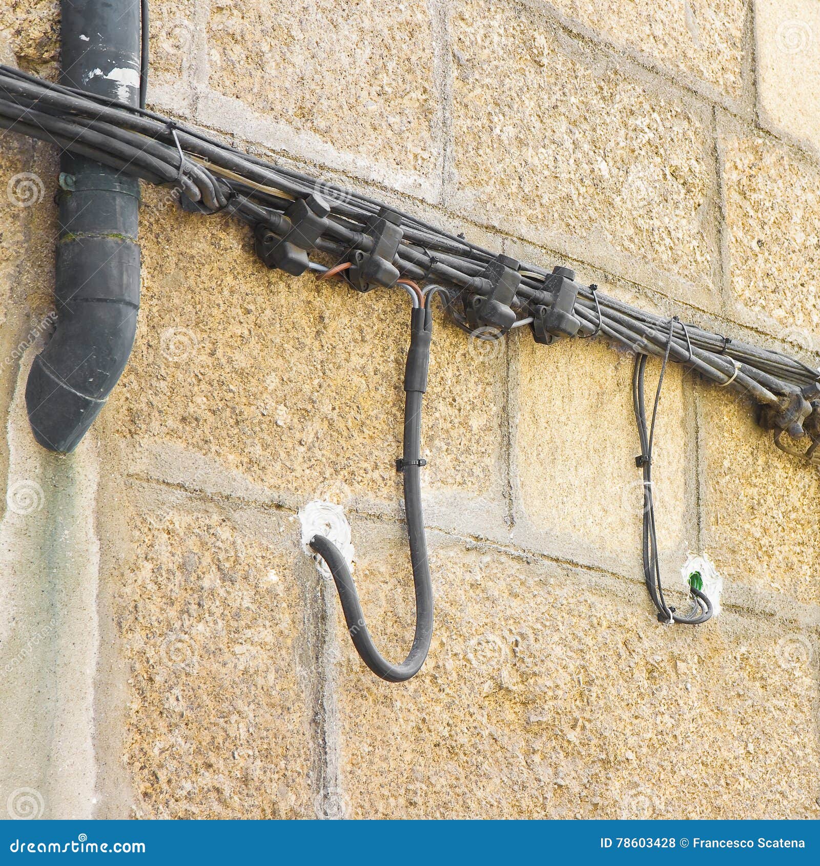 Electrical Power Cable Against a Stone Wall Stock Photo - Image of ...