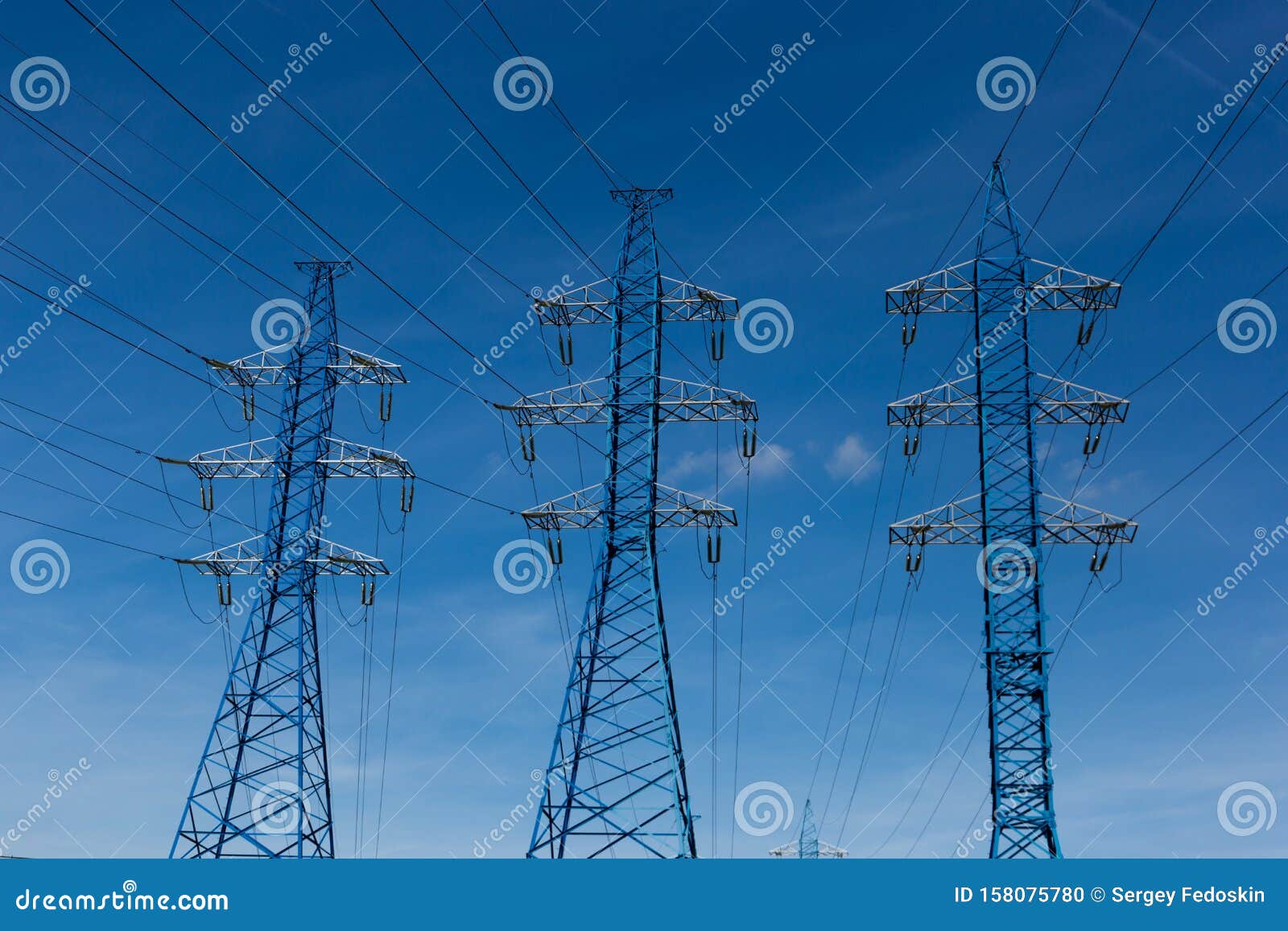 Electrical Power Lines on a Blue Sky Background Stock Photo - Image of ...