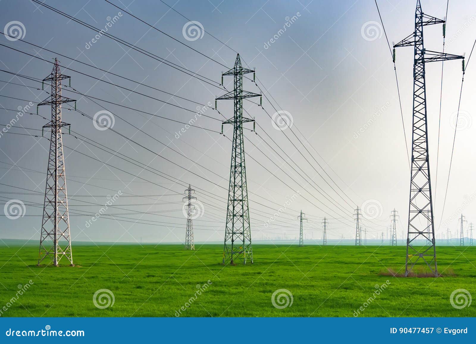 Electrical Pylons on Green Field Stock Image - Image of energy ...