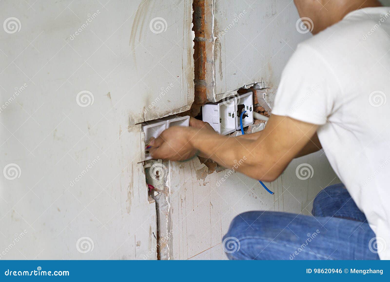 Electrical Renovation Work, Worker Installing the Electrical Box Stock ...