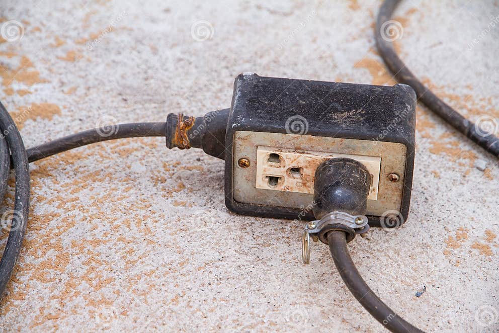 Electrical Socket with a Cord or Extension Cord Plugged in Stock Image ...