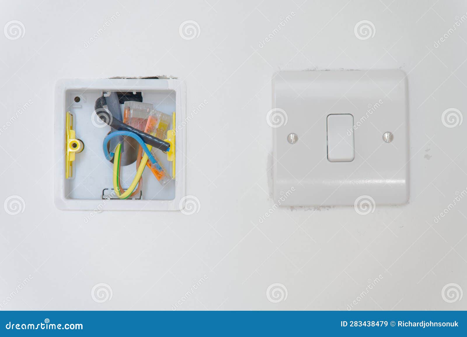 Electrical Socket Installation and Fitted Switch on Wall Stock Image ...