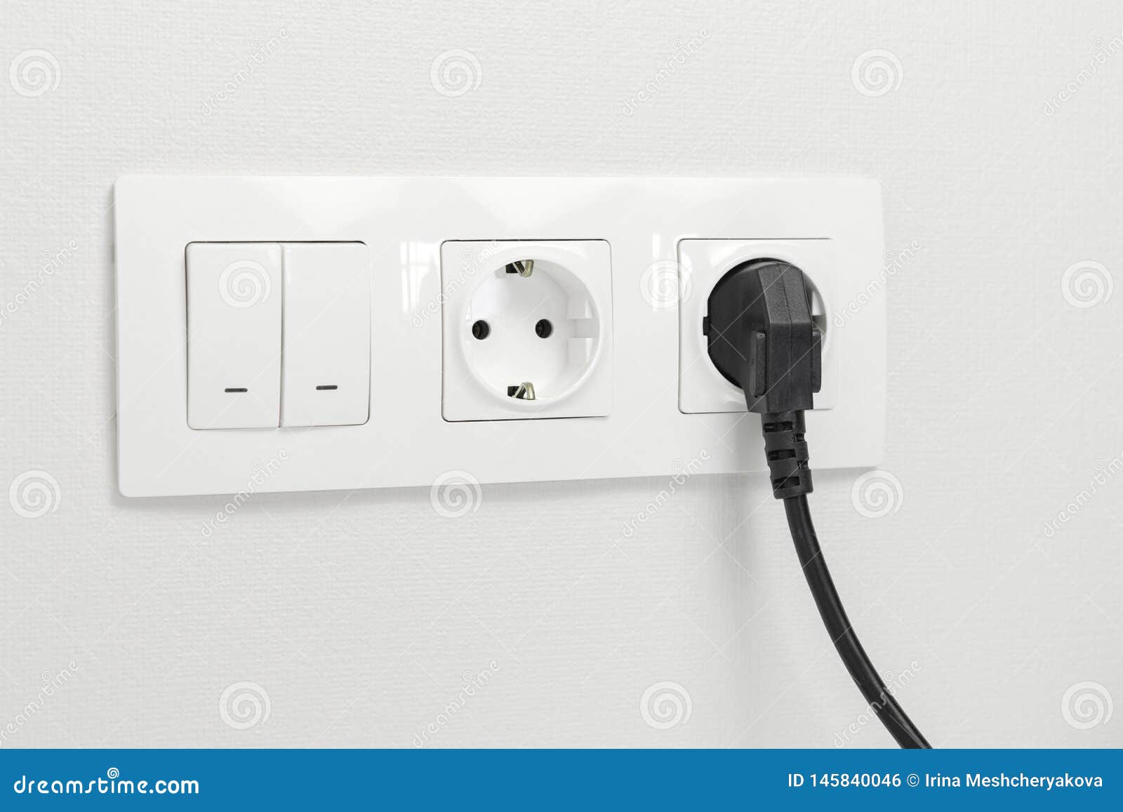 Electrical Sockets on the Wall with Black Connection Plug and White ...