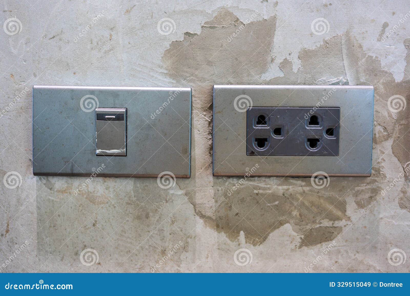 Electrical Switch and Electric Outlet on a Old Wall Concrete Stock ...