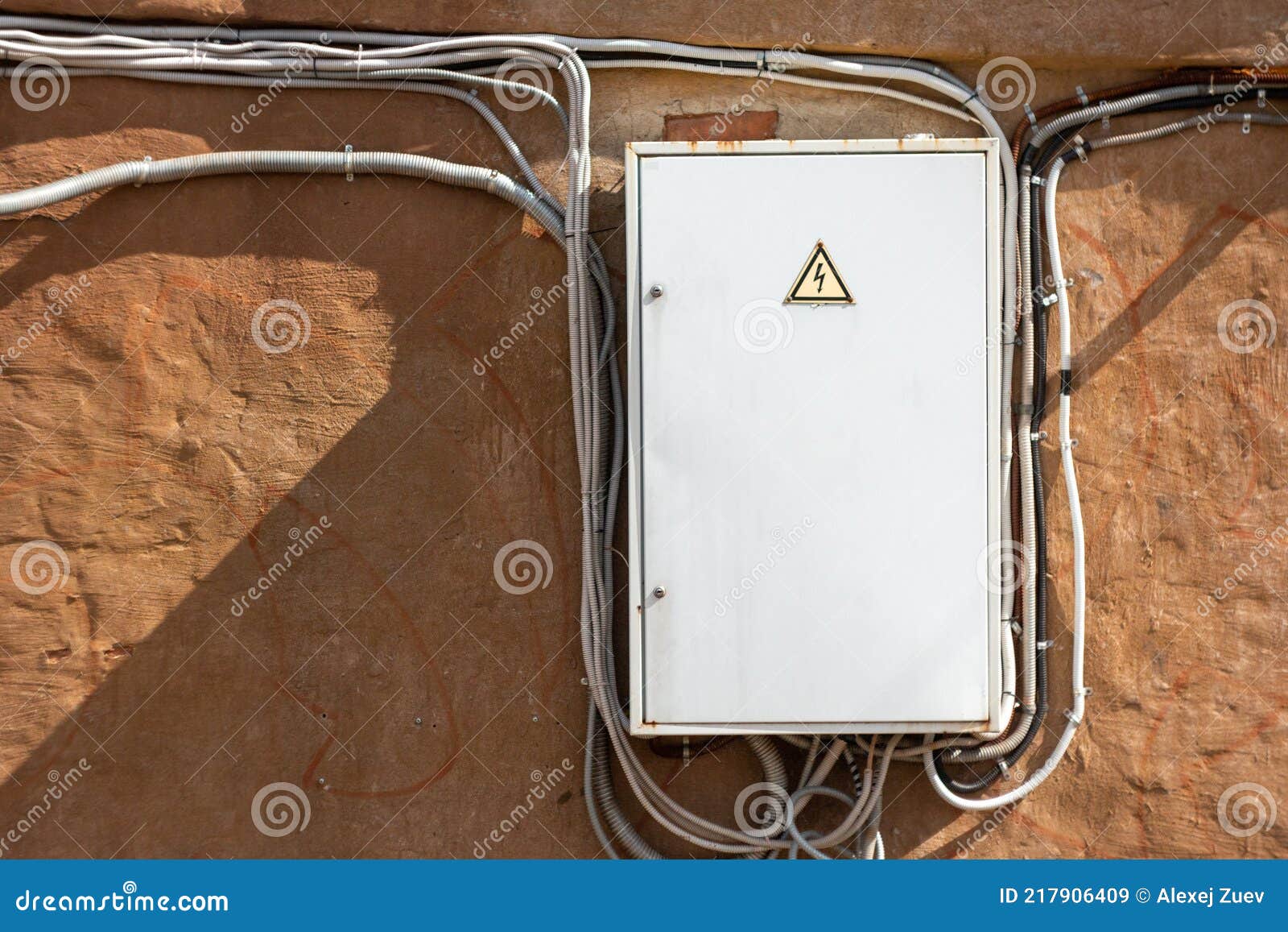 Electrical Switchboard with Cables on an Old Brick Wall. Stock Image ...