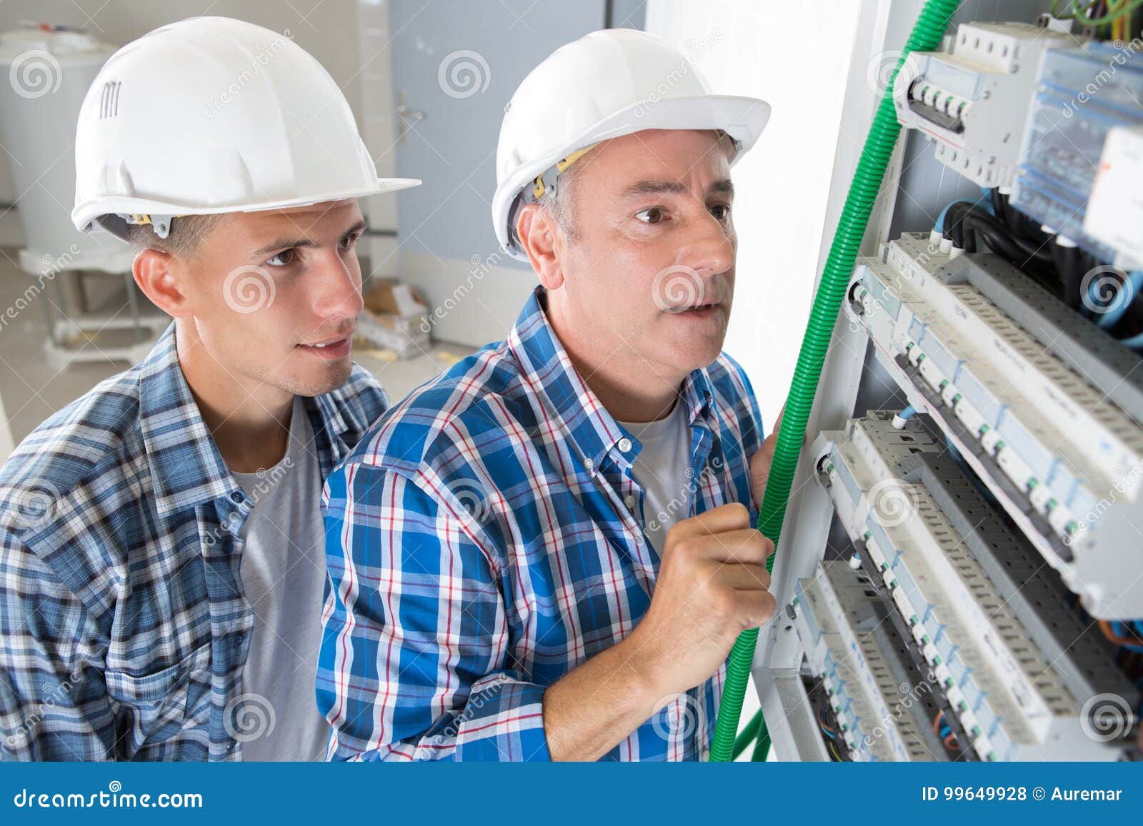 Electrical Team Installing Fuse Box Stock Photo - Image of blue ...