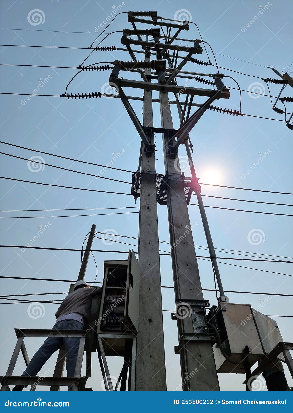 115kV Load Break Switch on Blue Sky with the Sun Shining Background ...
