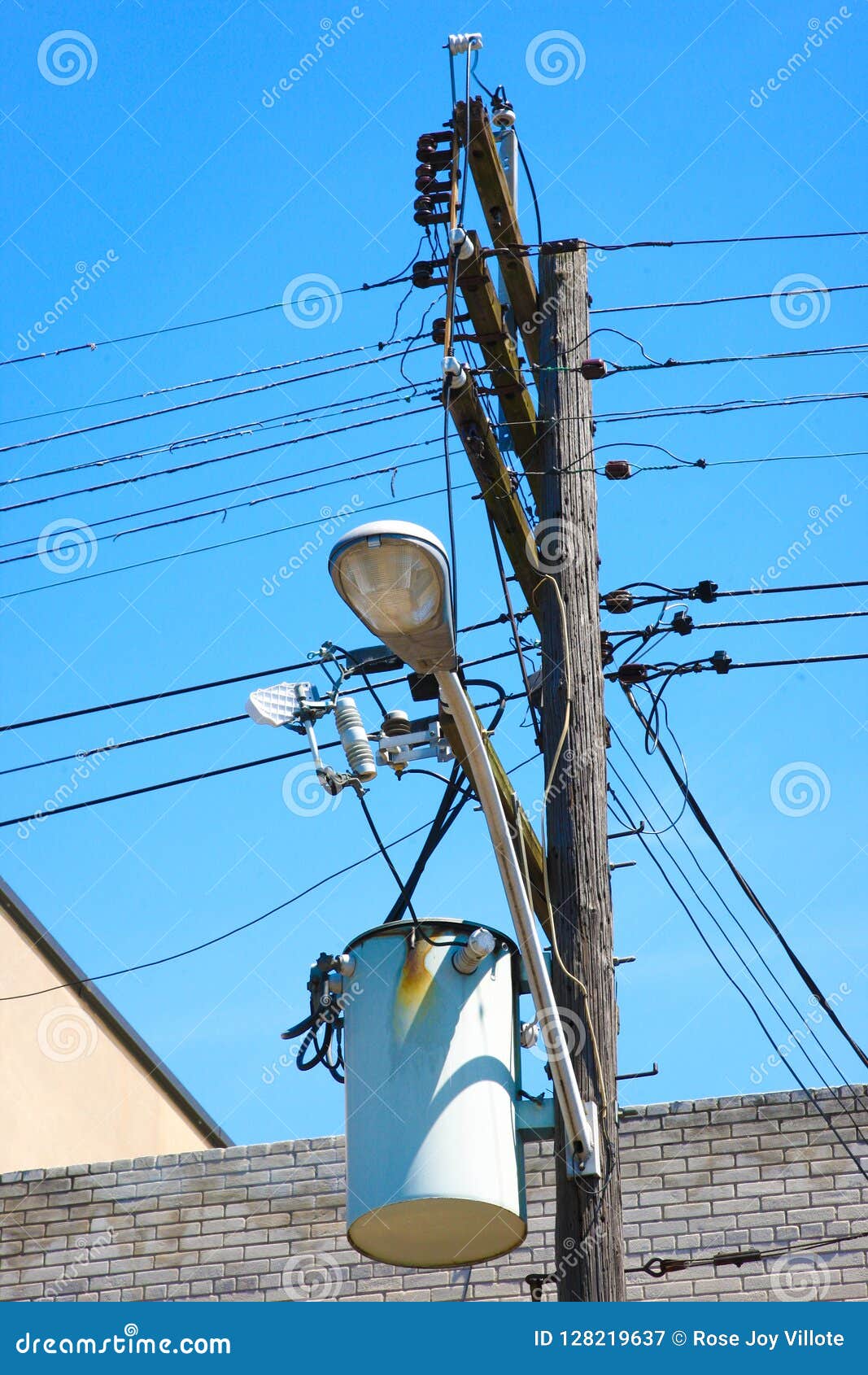 Electrical Transformer Attached To the Electric Post with Electric ...