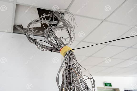 Electrical Wires Hanging from the Ceiling. Cables Hanging from Ceiling ...