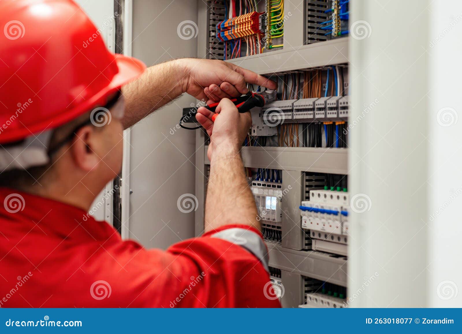 Electrical Wiring Repair. Repairman Repairs Electrical Panel Stock ...
