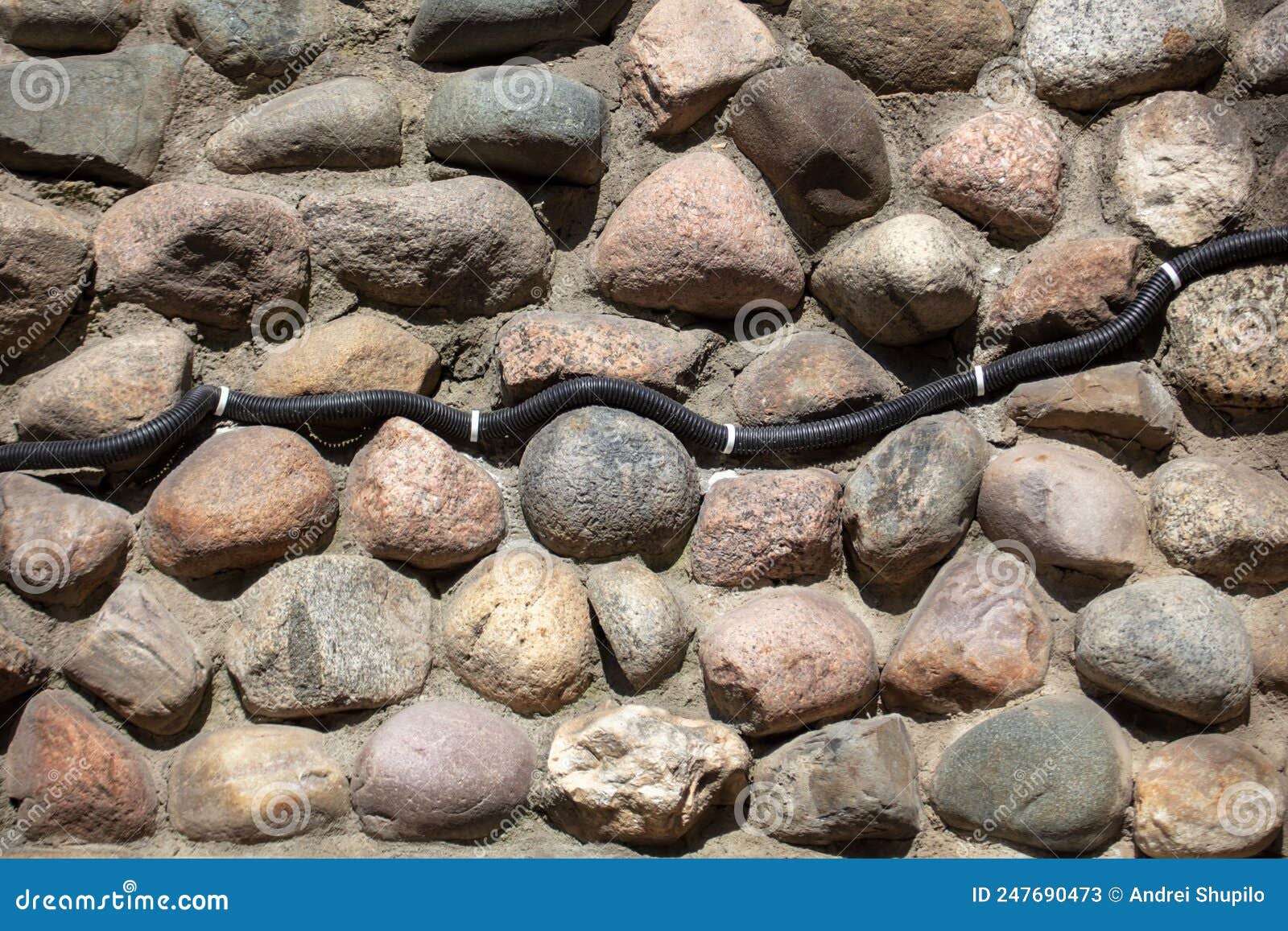 Electrical Wiring on the Wall of Stone Bricks. Stock Image - Image of ...