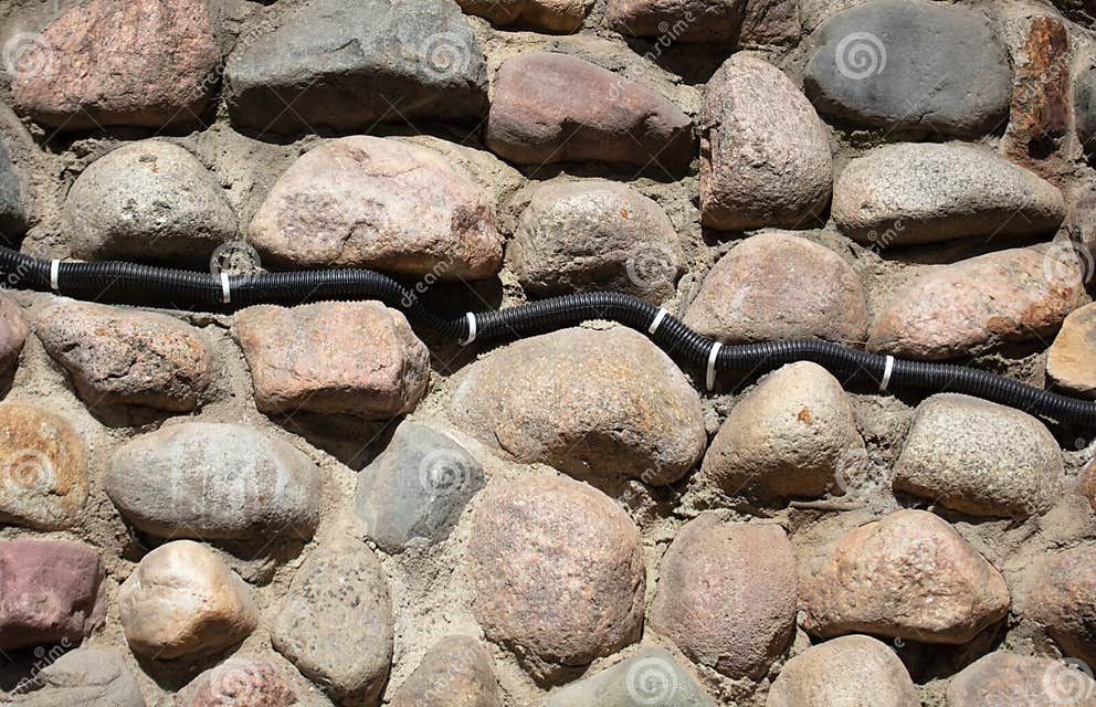 Electrical Wiring on the Wall of Stone Bricks. Stock Image - Image of ...