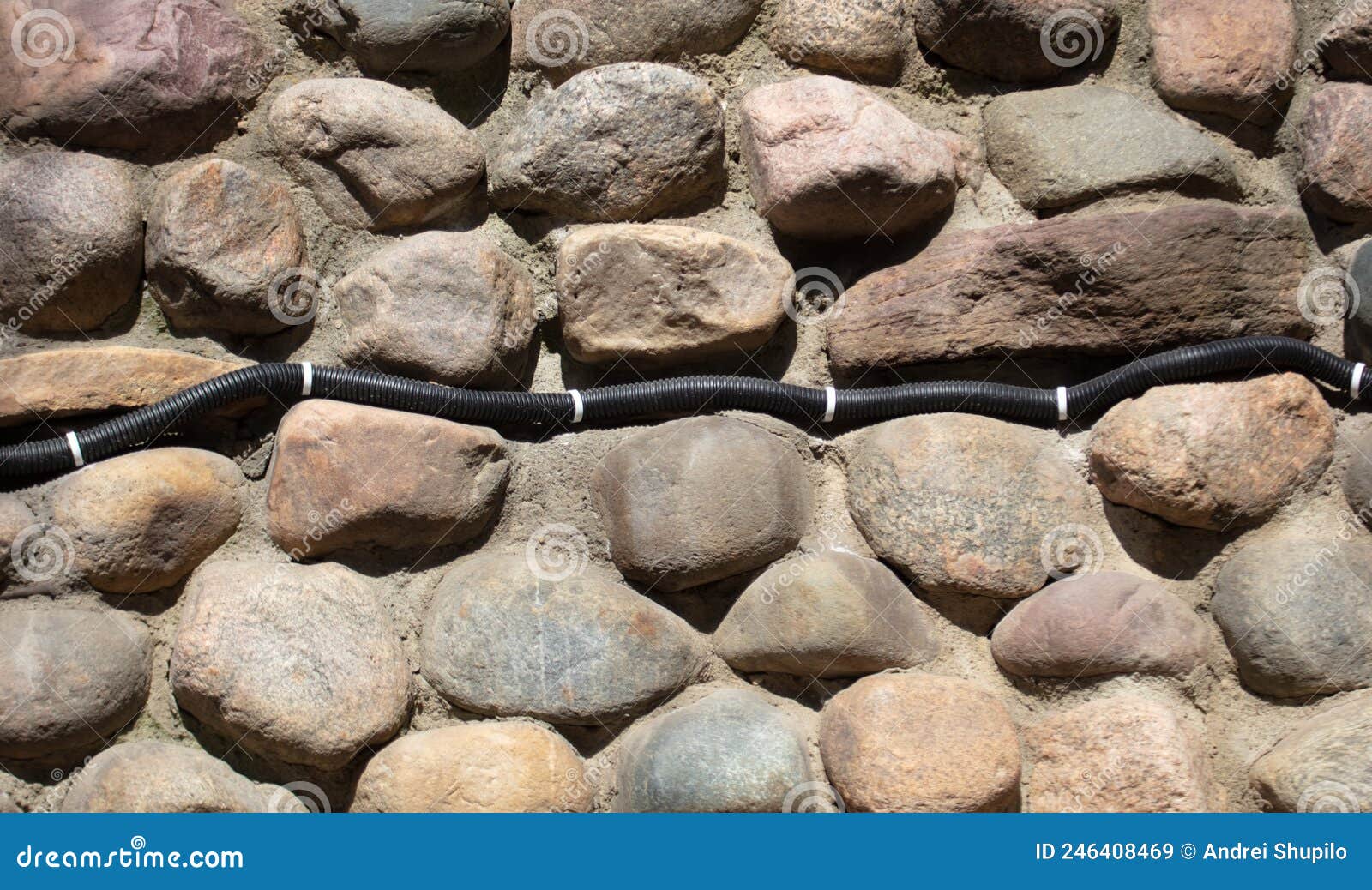 Electrical Wiring on the Wall of Stone Bricks. Stock Image - Image of ...