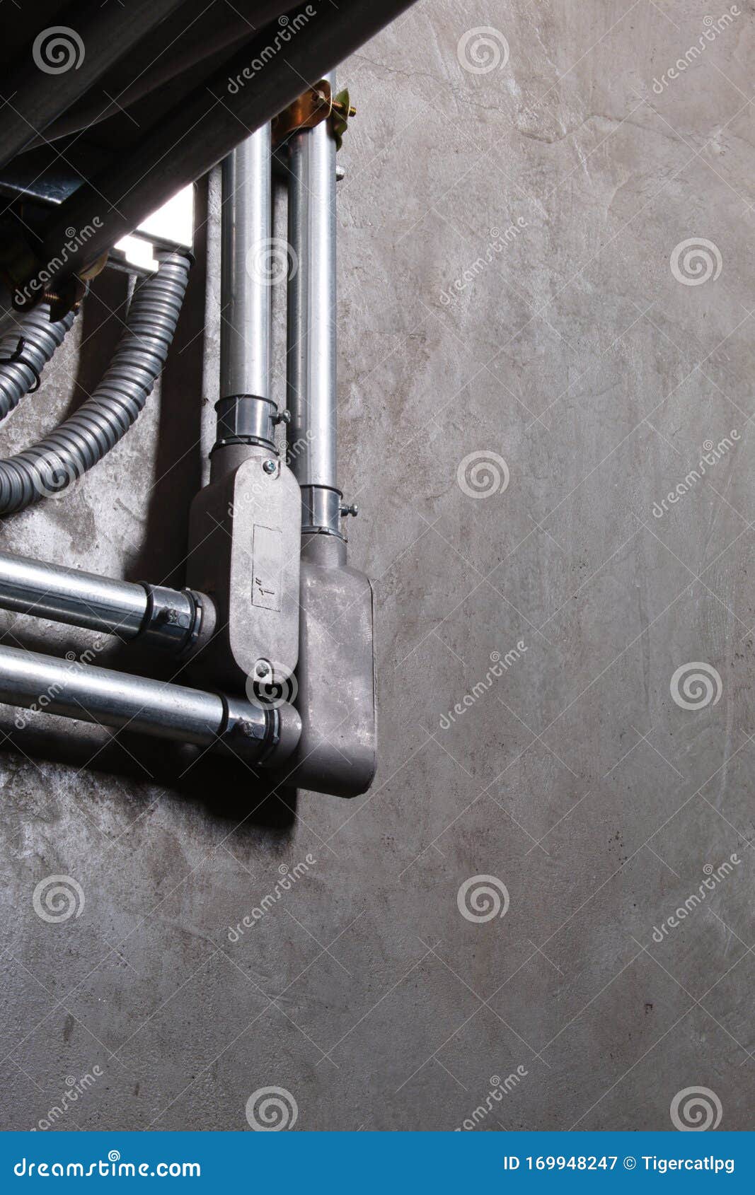 Electrical Wiring Work in a Steel Pipe of a House with a Loft Style ...