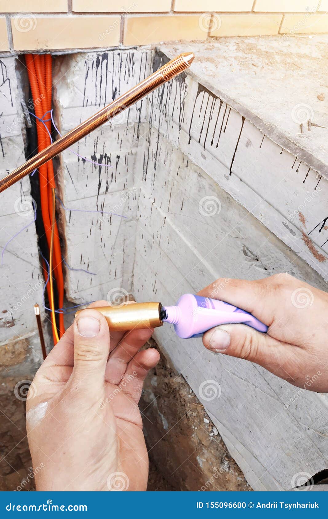 The Electrical Wizard Conducts Protective Grounding Near the House ...