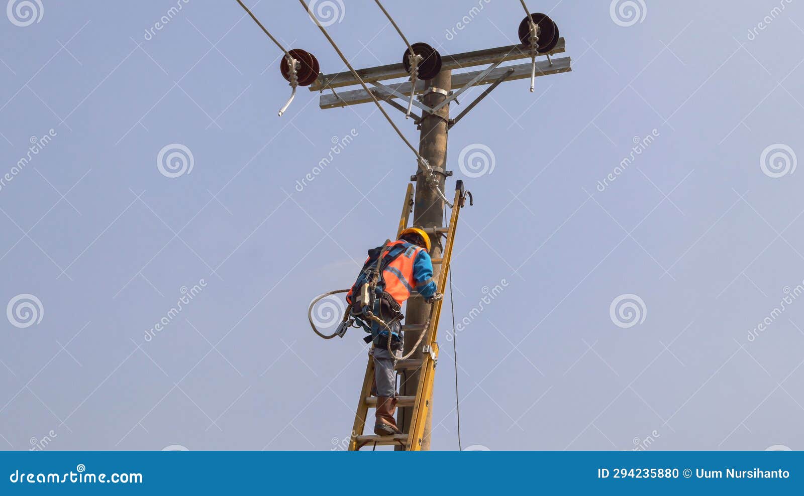 An Electrical Worker is Installing Grounding on a High Voltage Stock ...