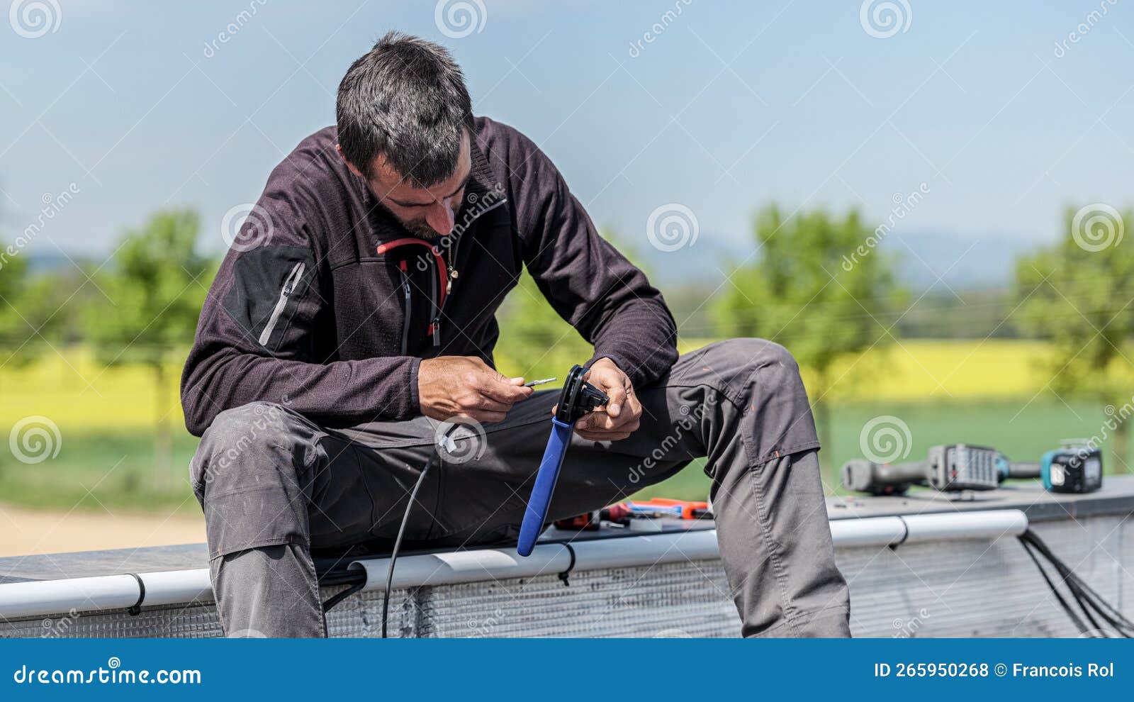 Electrical Worker Preparing Electrical Connection Cables for Solar ...
