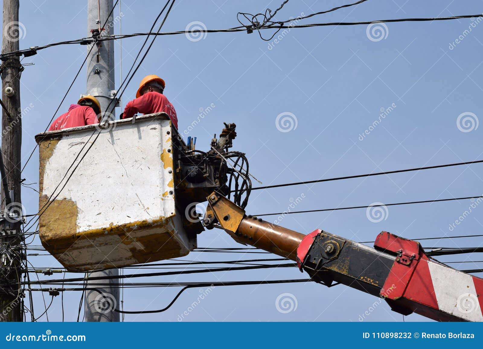 Electrical Workers on Telehandler with Bucket Installing High Tension ...