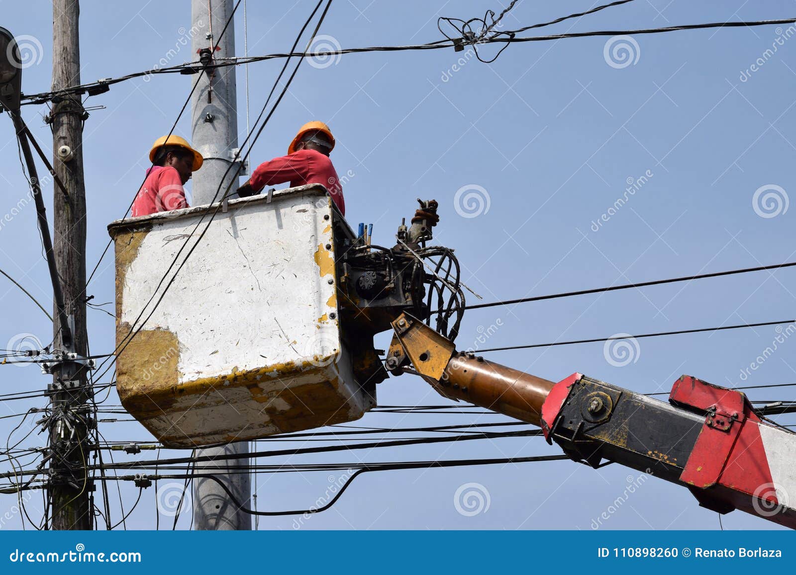 Electrical Workers on Telehandler with Bucket Installing High Tension ...