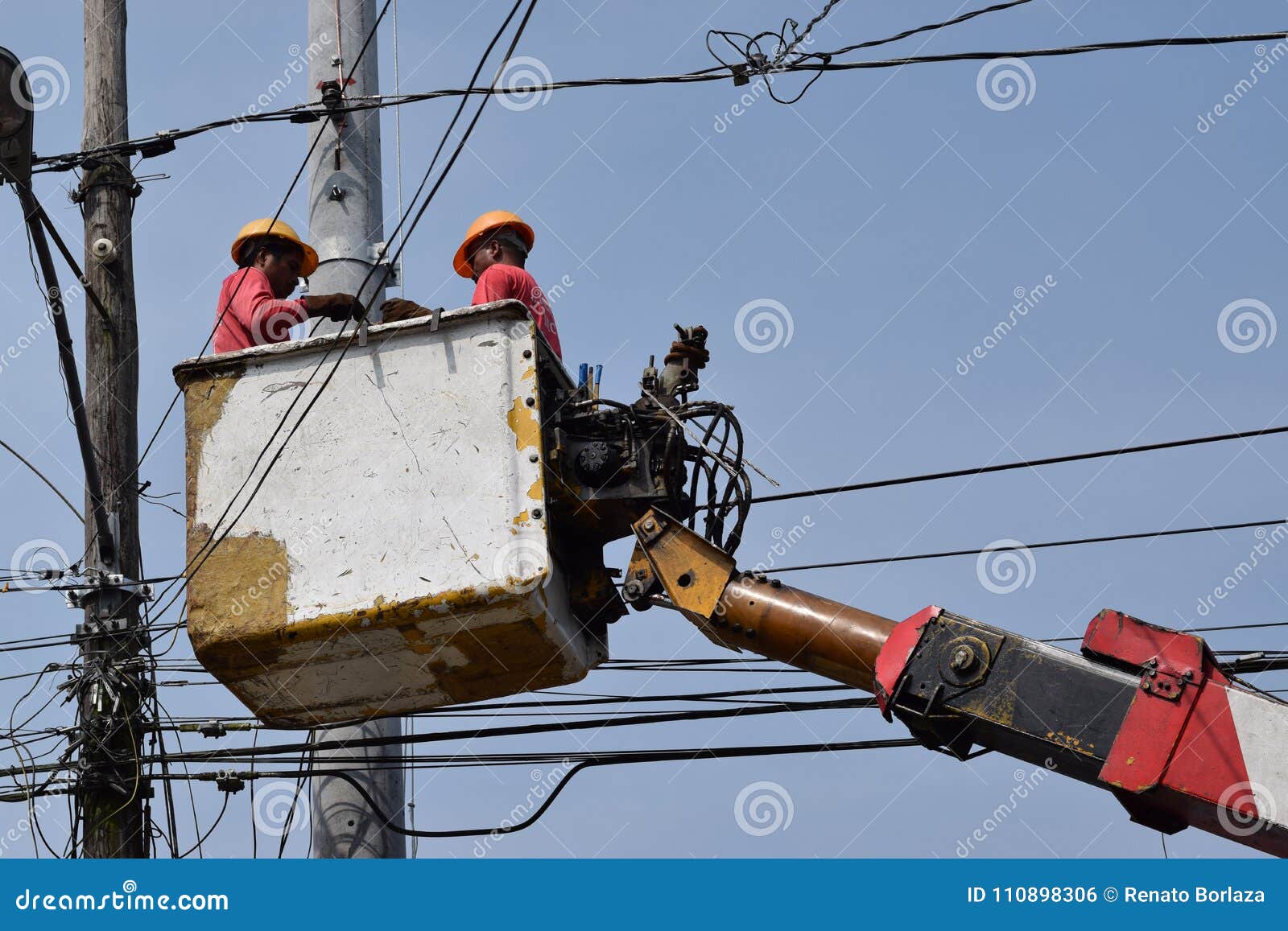 Electrical Workers on Telehandler with Bucket Installing High Tension ...