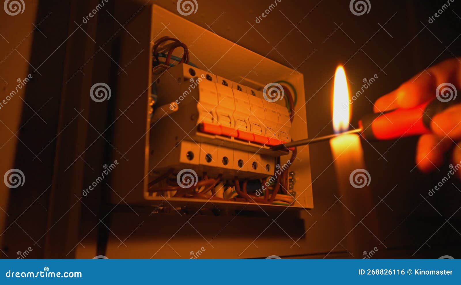 Electrician Assembles Electrical Panel in Dark by Light of Burning ...