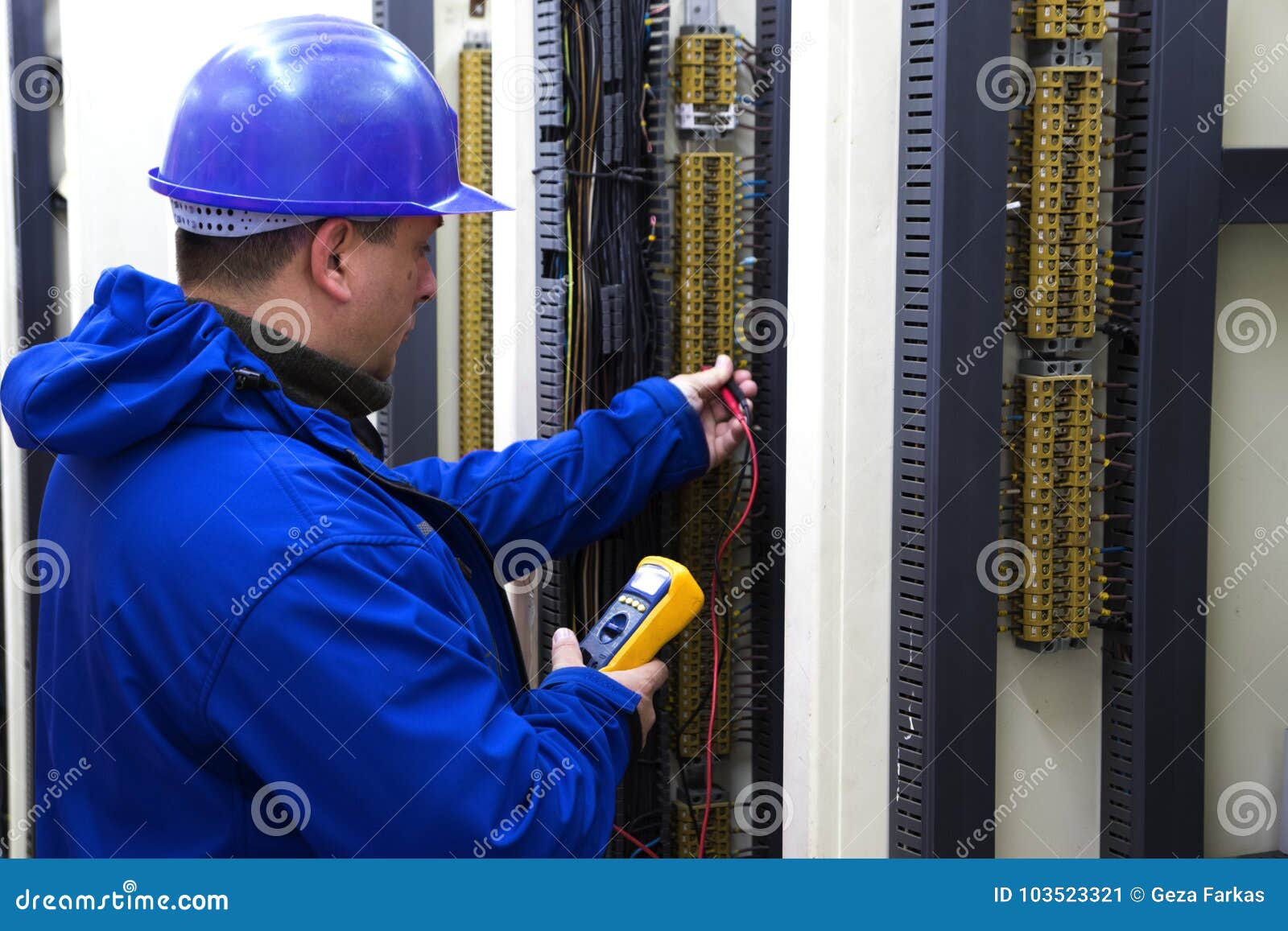 Electrician in Blue Control Circuit with Multimeter Stock Image - Image ...