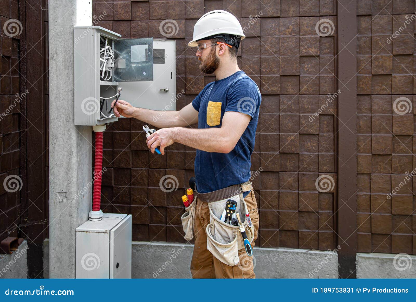 Electrician Builder at Work, Examines the Cable Connection in the ...