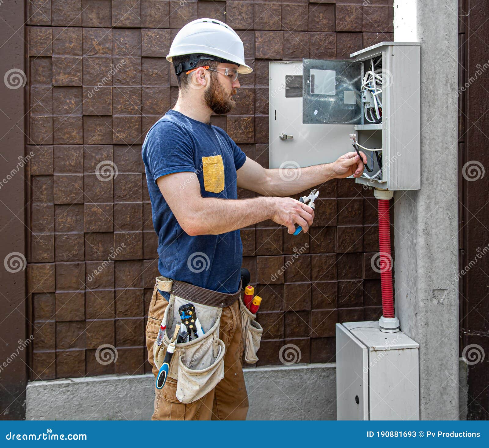 Electrician Builder at Work, Examines the Cable Connection in the ...