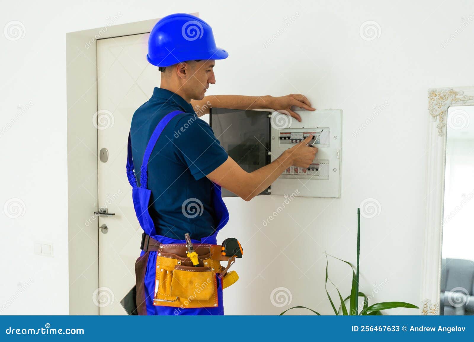 Electrician Builder at Work, Examines the Cable Connection in the ...