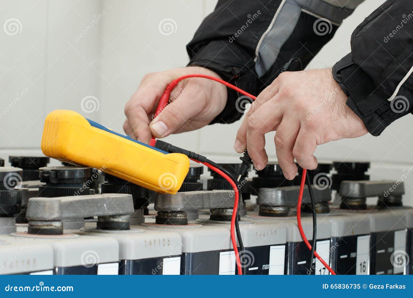 Electrician Check Battery with Yellow Multimeter Stock Image - Image of ...