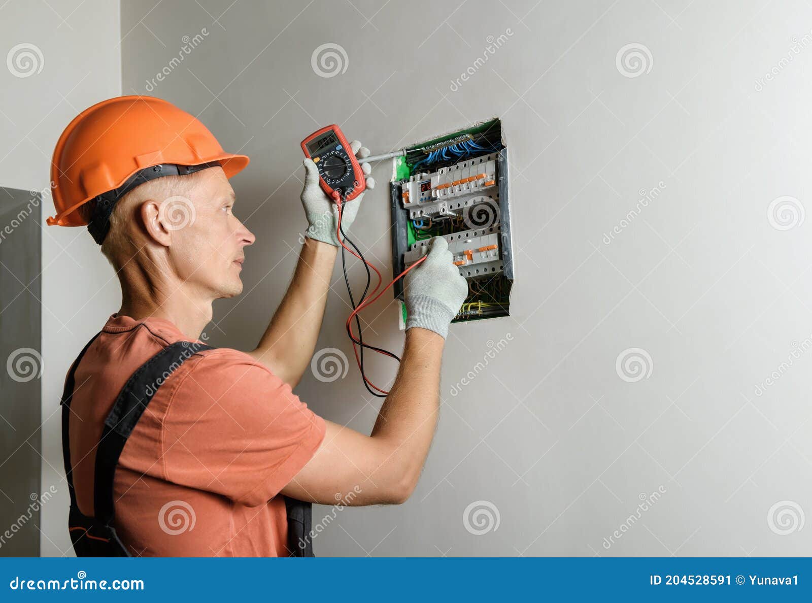 Electrician is Checking with a Multimeter the Correctness of the ...