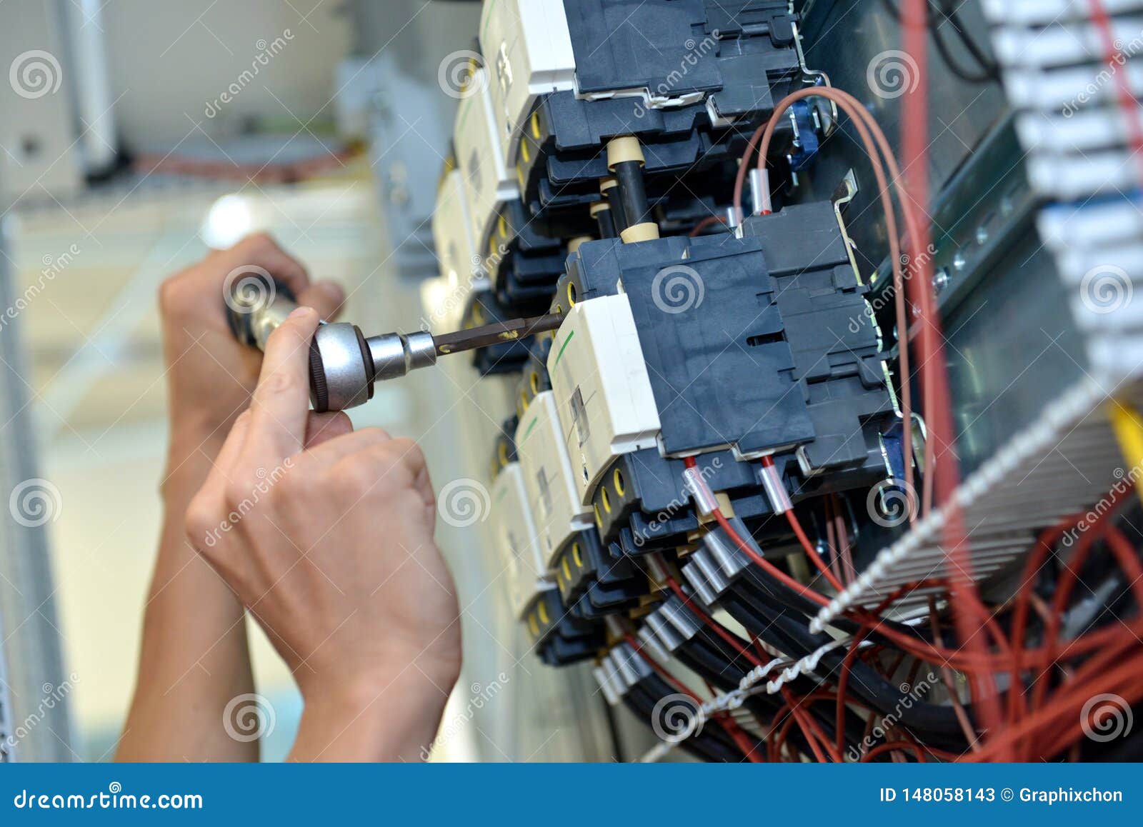 The Electrician is Connecting the Electric Cable Wire. Stock Image ...